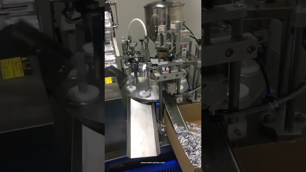 Rotary machine for filling, folding, sealing, and packaging aluminum ...